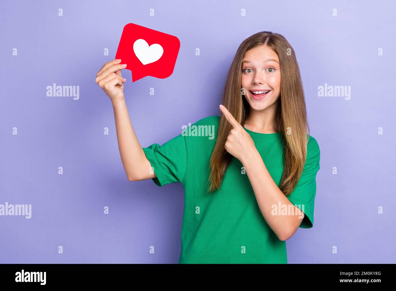 Photo of positive cute lady wear green stylish clothes arm direct red ...