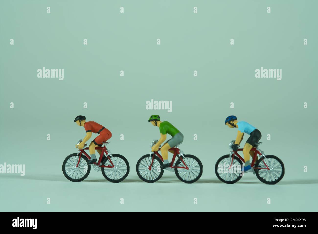 A group of racing cyclists isolated on light background, view from the ...