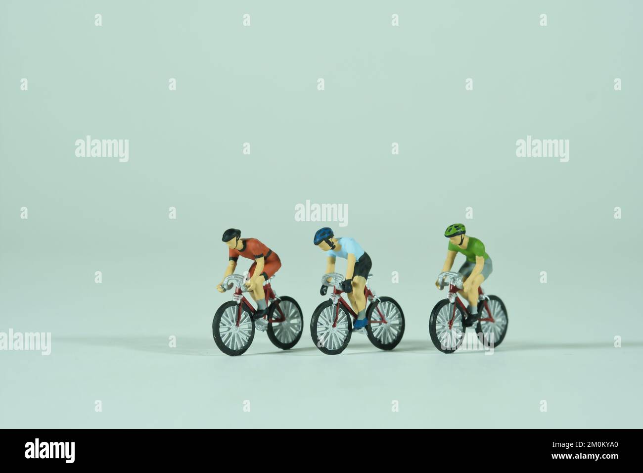 Racing cyclist isolated on light background, side front view Stock ...