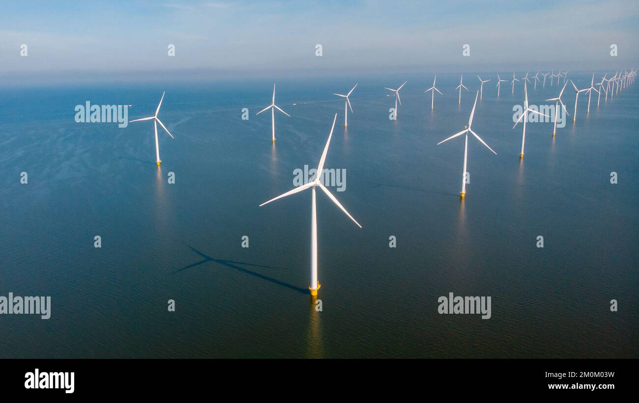 Wind mill park with Windmill turbines generating electricity with a ...