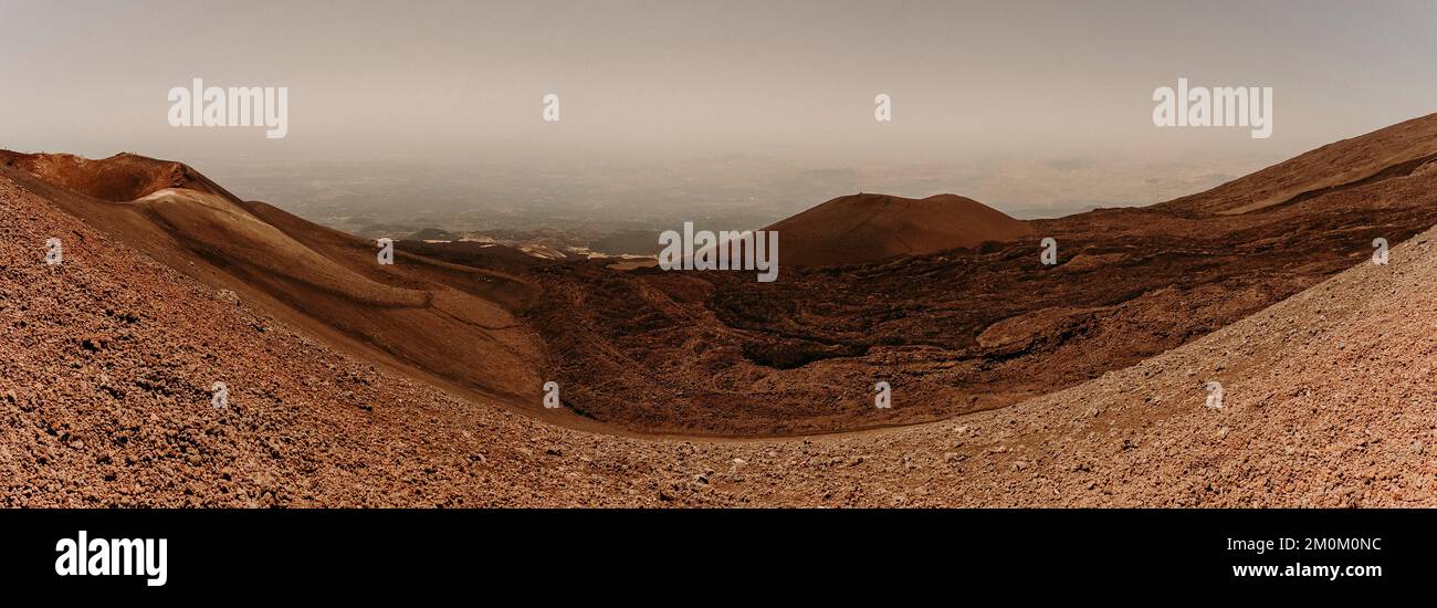 A panoramic shot of Mount Etna slowly erupting in Sicily, Italy Stock ...
