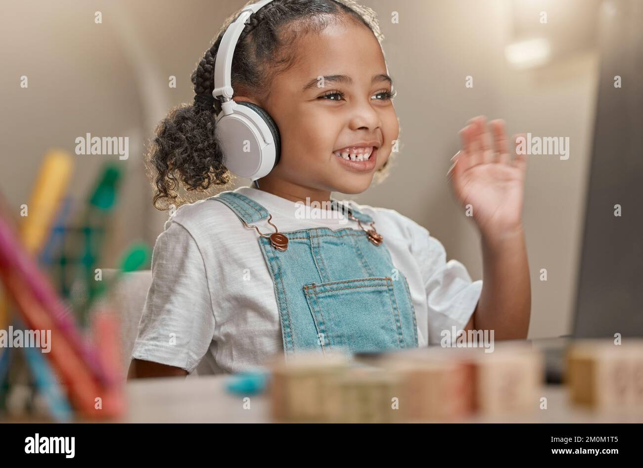 Video call, headphones and child in e learning on laptop, home desk and ... Video call, headphones and child in e learning on laptop, home desk and ...