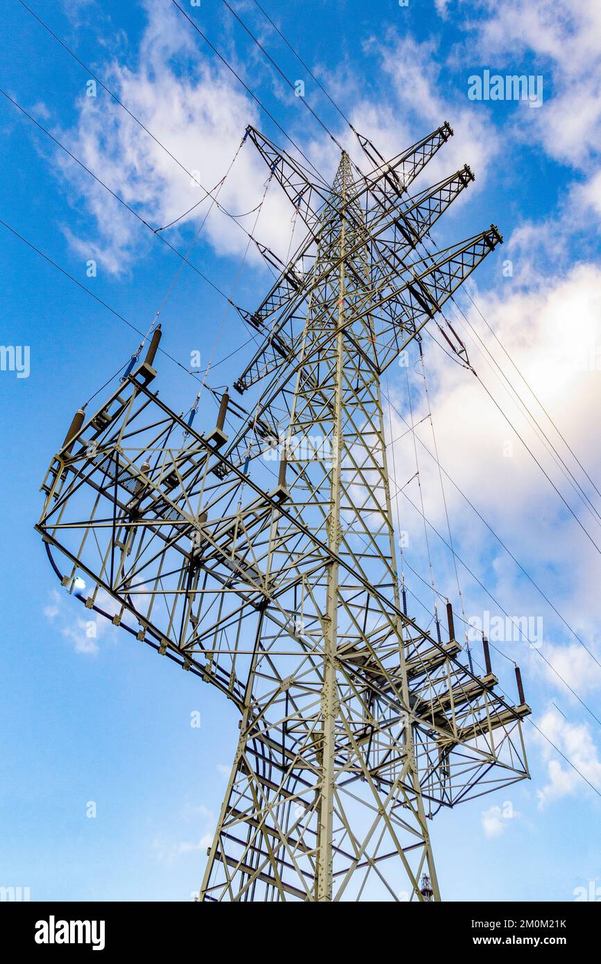 view of electric pylon under clear blue sky Stock Photo - Alamy
