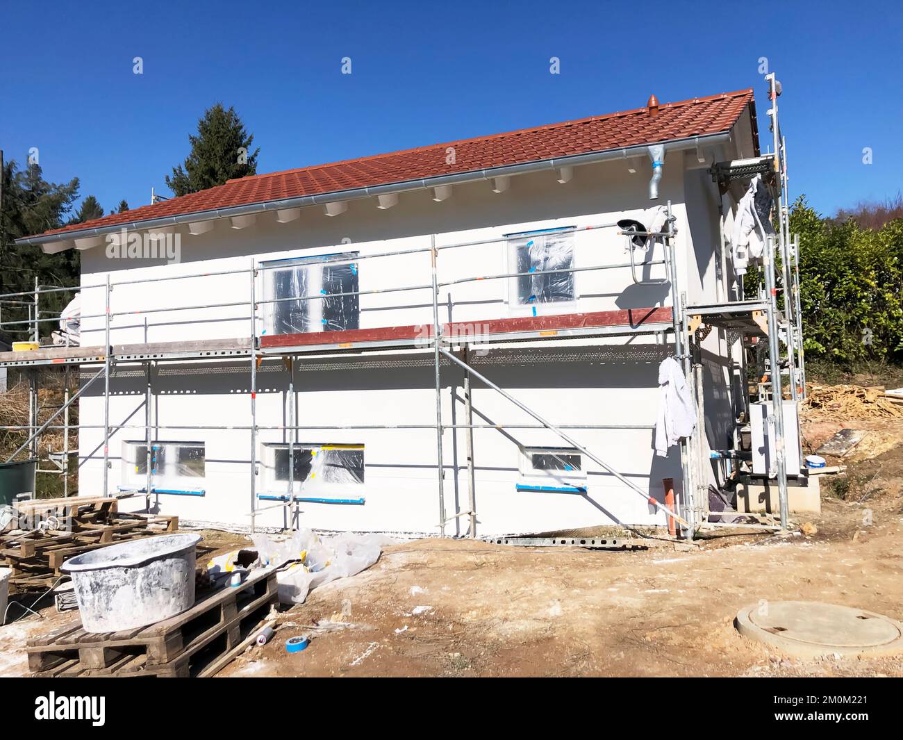 New construction site with finished base plaster Stock Photo - Alamy