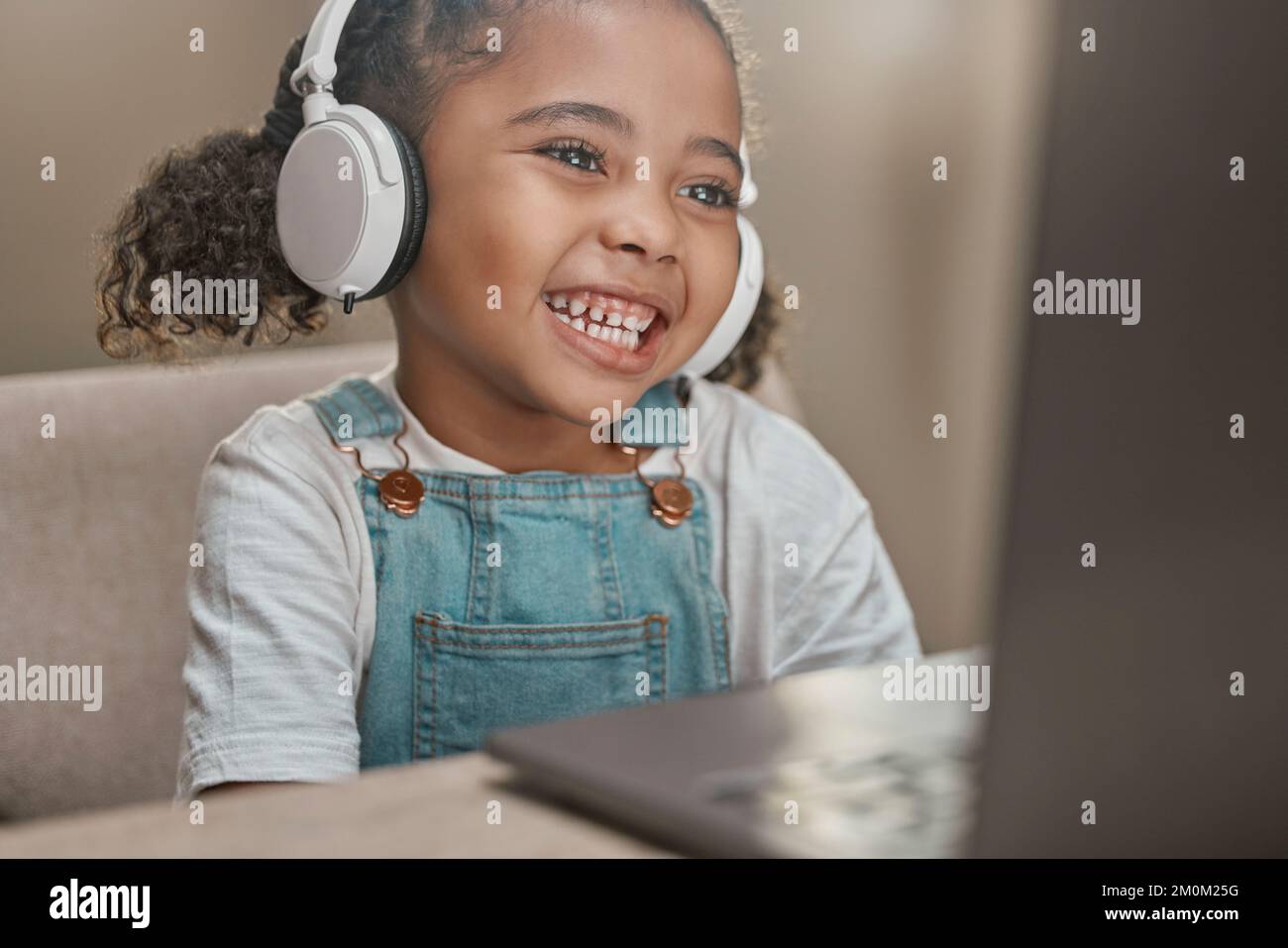 Education, learning and laptop with girl and headphones for video call ...