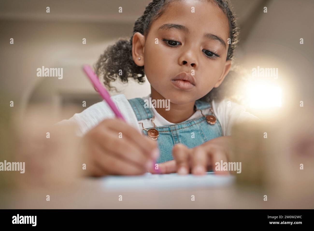 Student, child learning and writing in notebook for development, fine ...