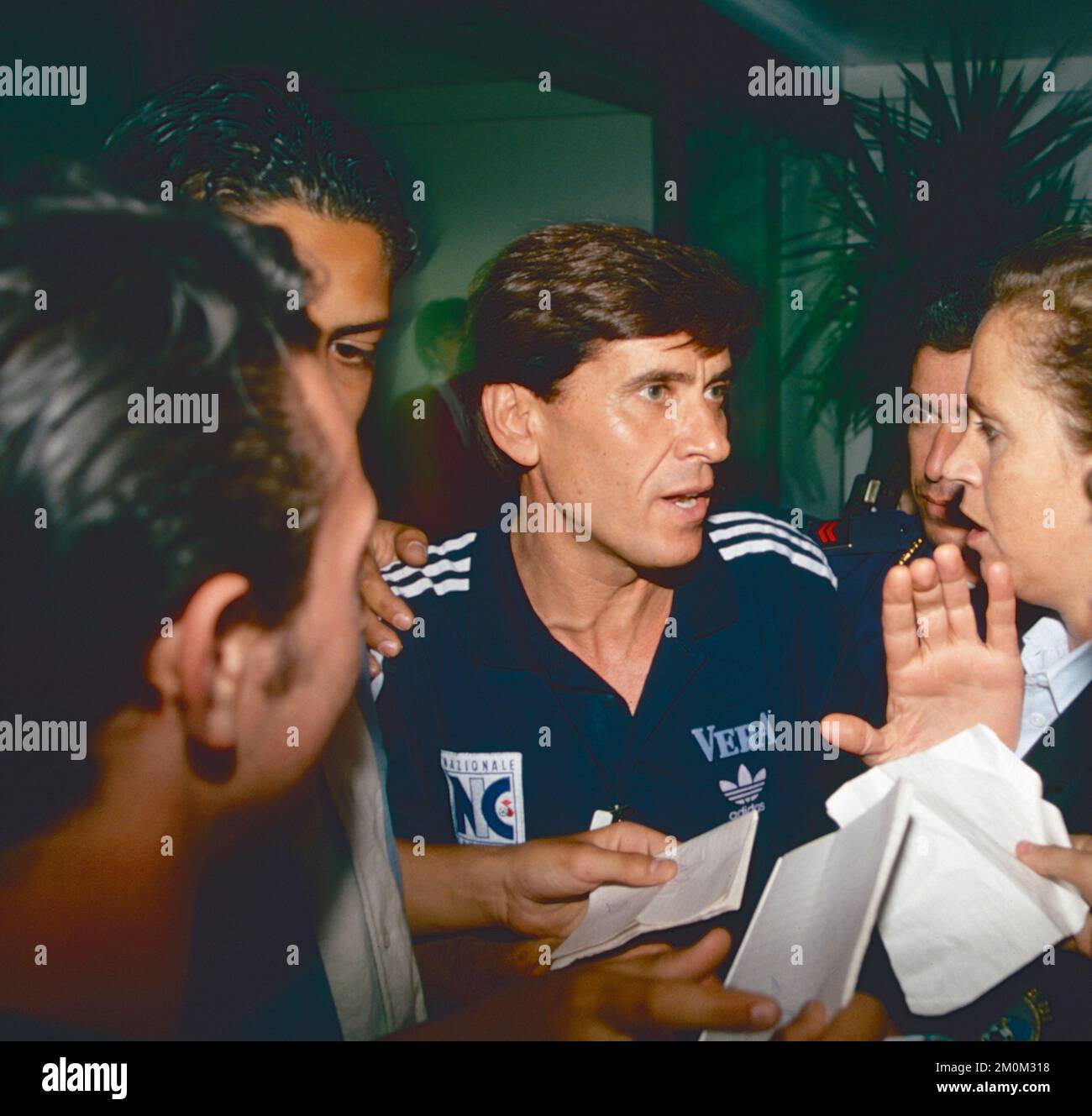 Italian singer Gianni Morandi signing autographs for the fans before ...