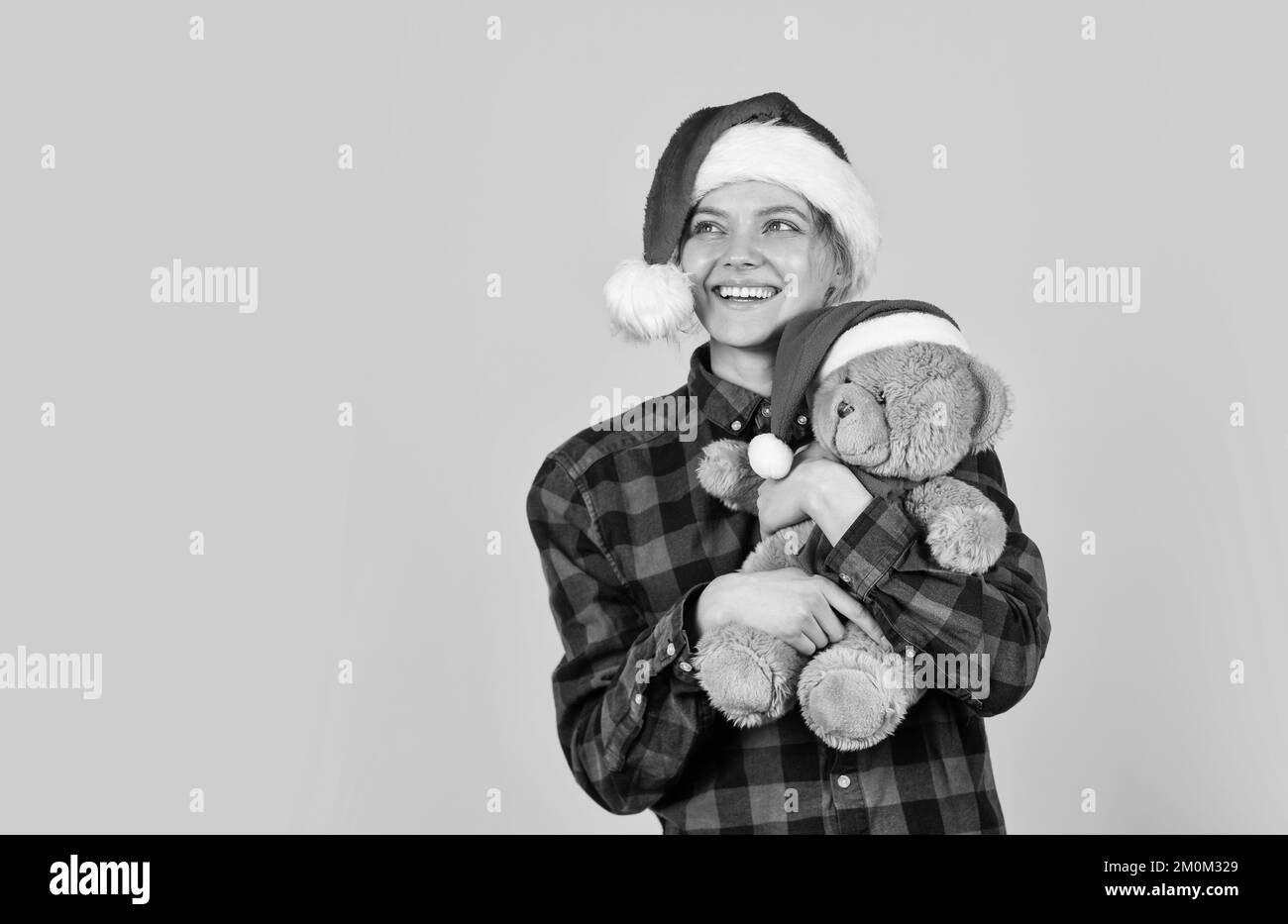 Christmas memories from childhood. Girl with teddy bear. Charity and ...