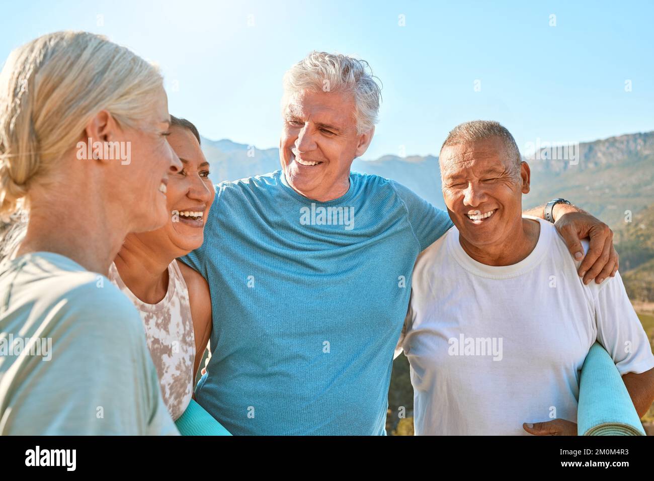 Group of diverse senior friends talking and standing together after ...