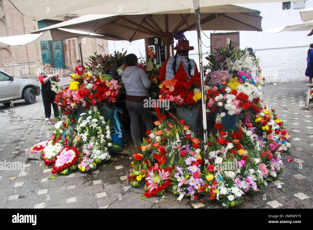 flowers stall in an Open air market stall in the central plaza Cuenca ...