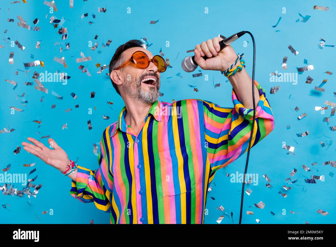 Photo of old mature funky artist man brunet hair sing microphone wear ...