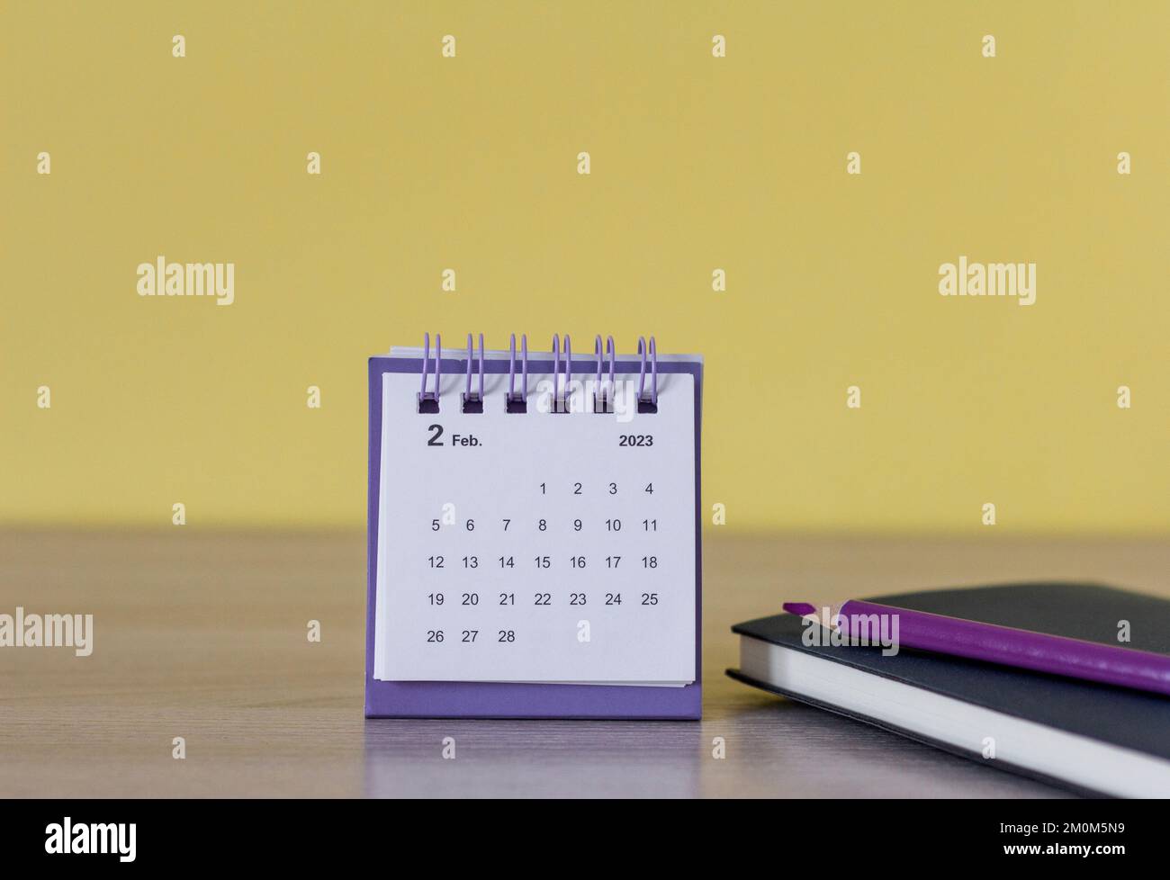 Desktop calendar for February 2023 on the table Stock Photo - Alamy