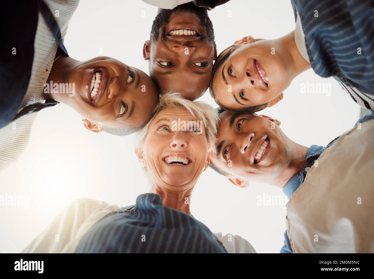 Group of five cheerful diverse clothing designers standing together in ...