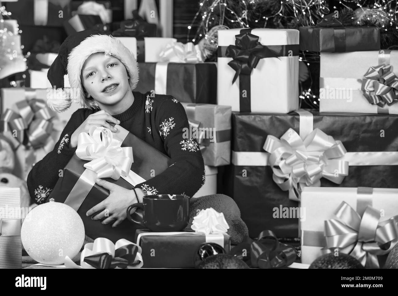 Leisure and activity. Boxing day. Intrigued cute santa. Child little ...