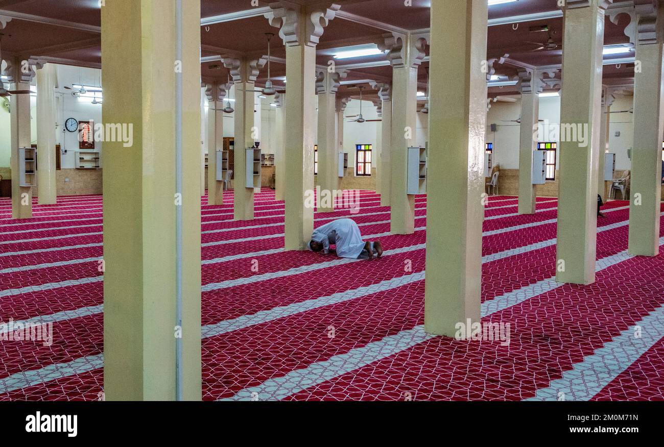 A person takes part in morning prayers in a mosque in Souq Waqif in ...