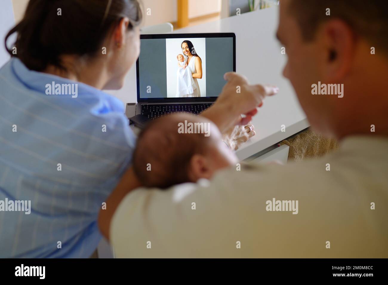 Mother watching family photo hi-res stock photography and images - Alamy