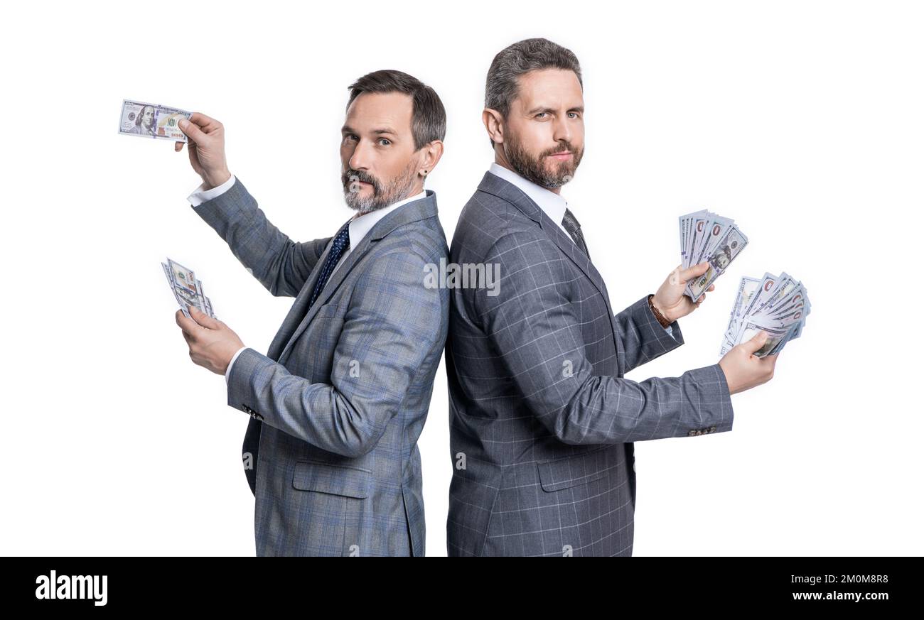 businessmen holding money earning in studio. businessmen hold money ...