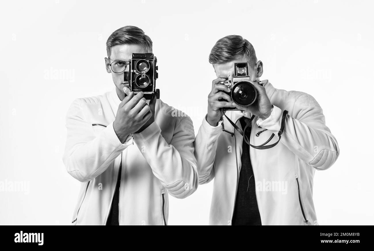 young twin brothers photographer with similar appearance make photo ...