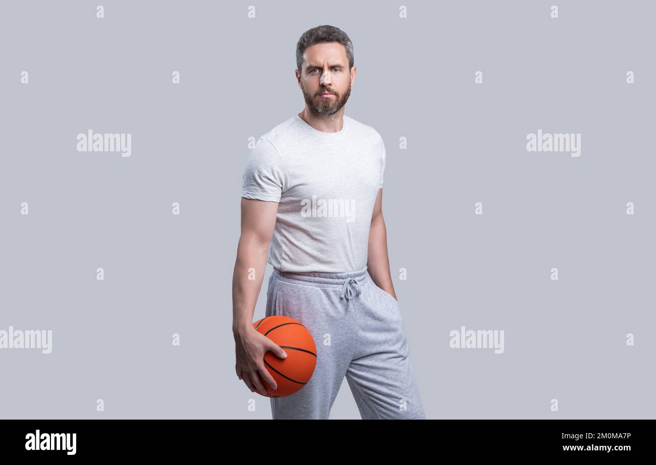 serious athlete basketball player in studio. photo of athlete ...