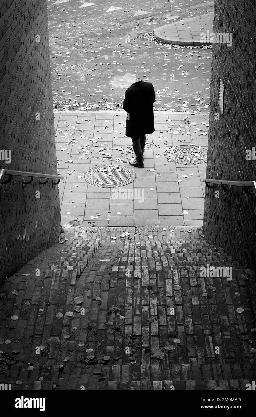 Man without head smoking on street at the bottom of stairs Stock Photo ...