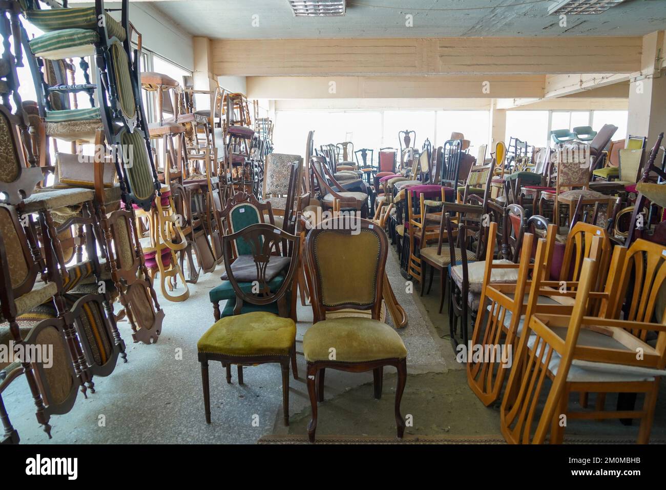Old discarded furniture in the interior of an abandoned building ...