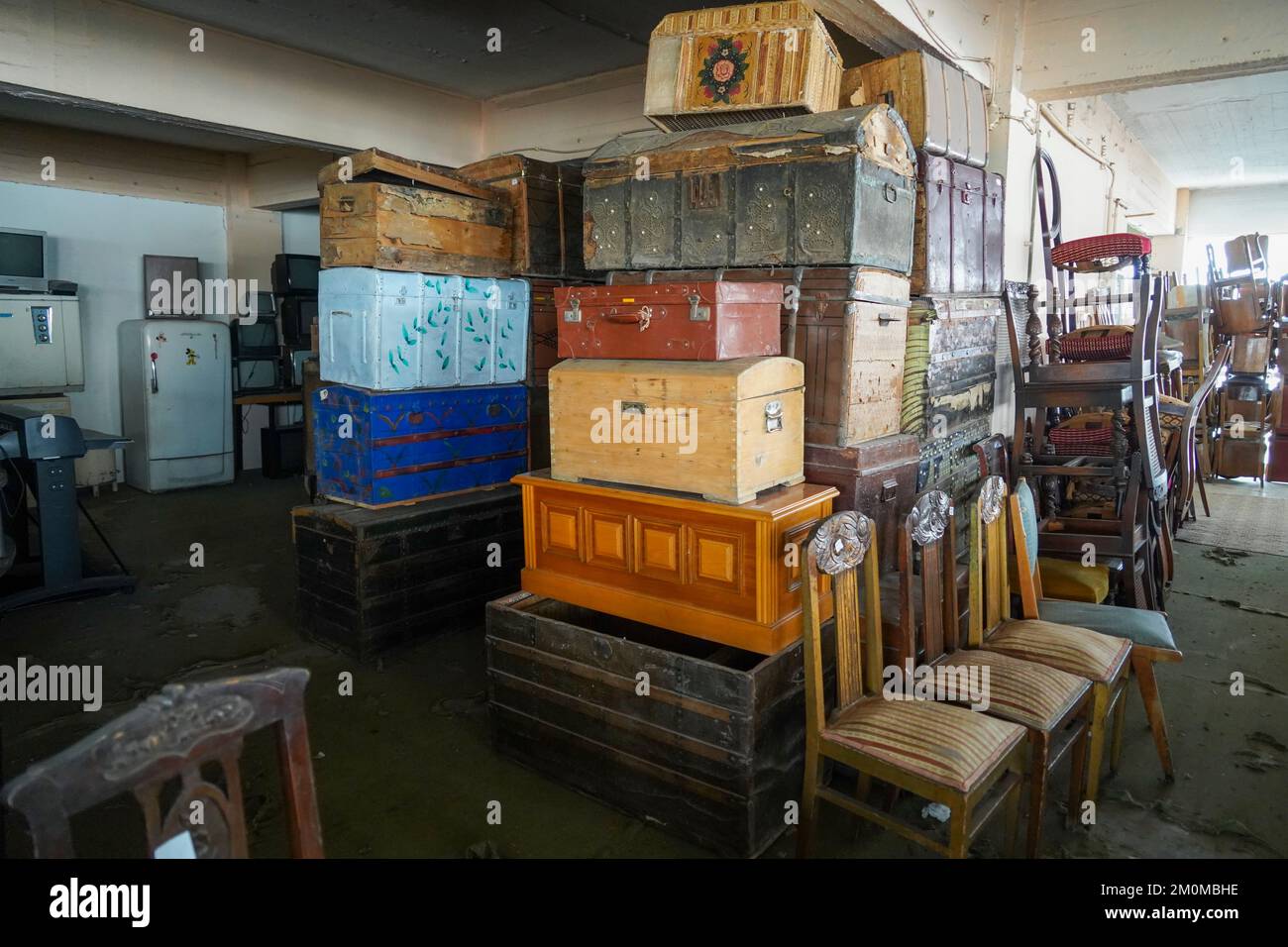 Old discarded furniture in the interior of an abandoned building ...