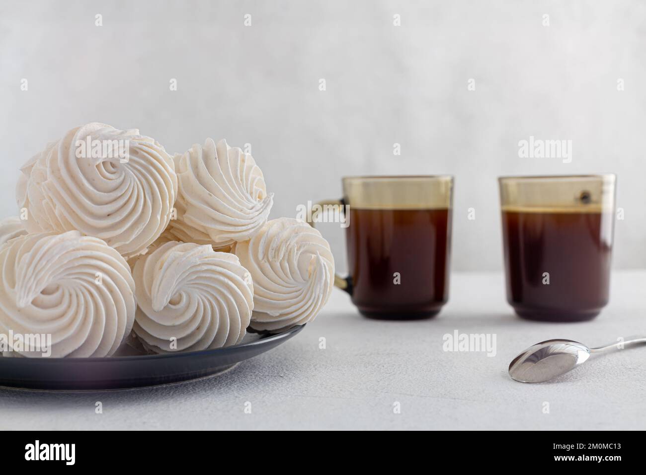 tea party with delicate airy zephyr on a light background. homemade ...