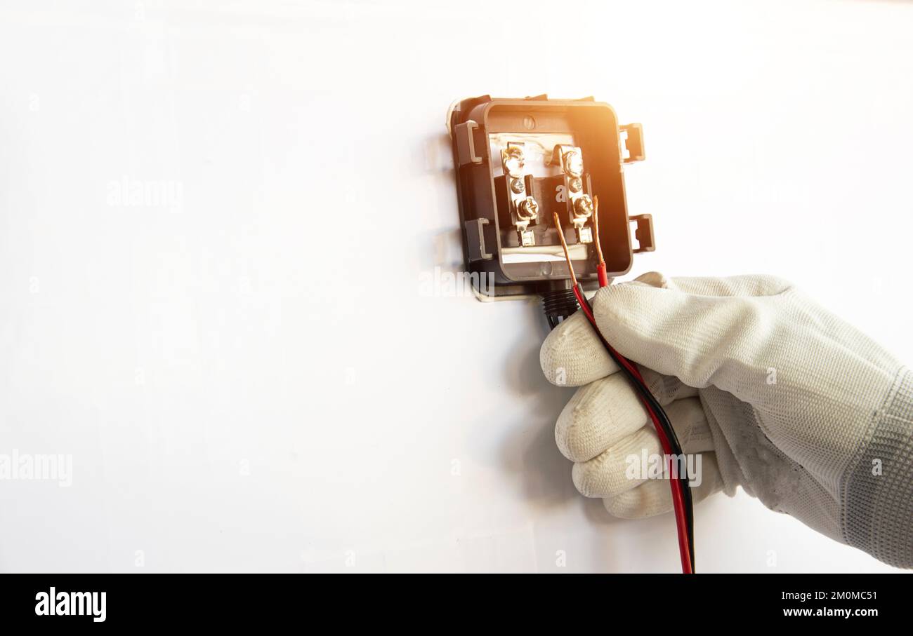 Technicians are connecting wires to solar panels Stock Photo - Alamy