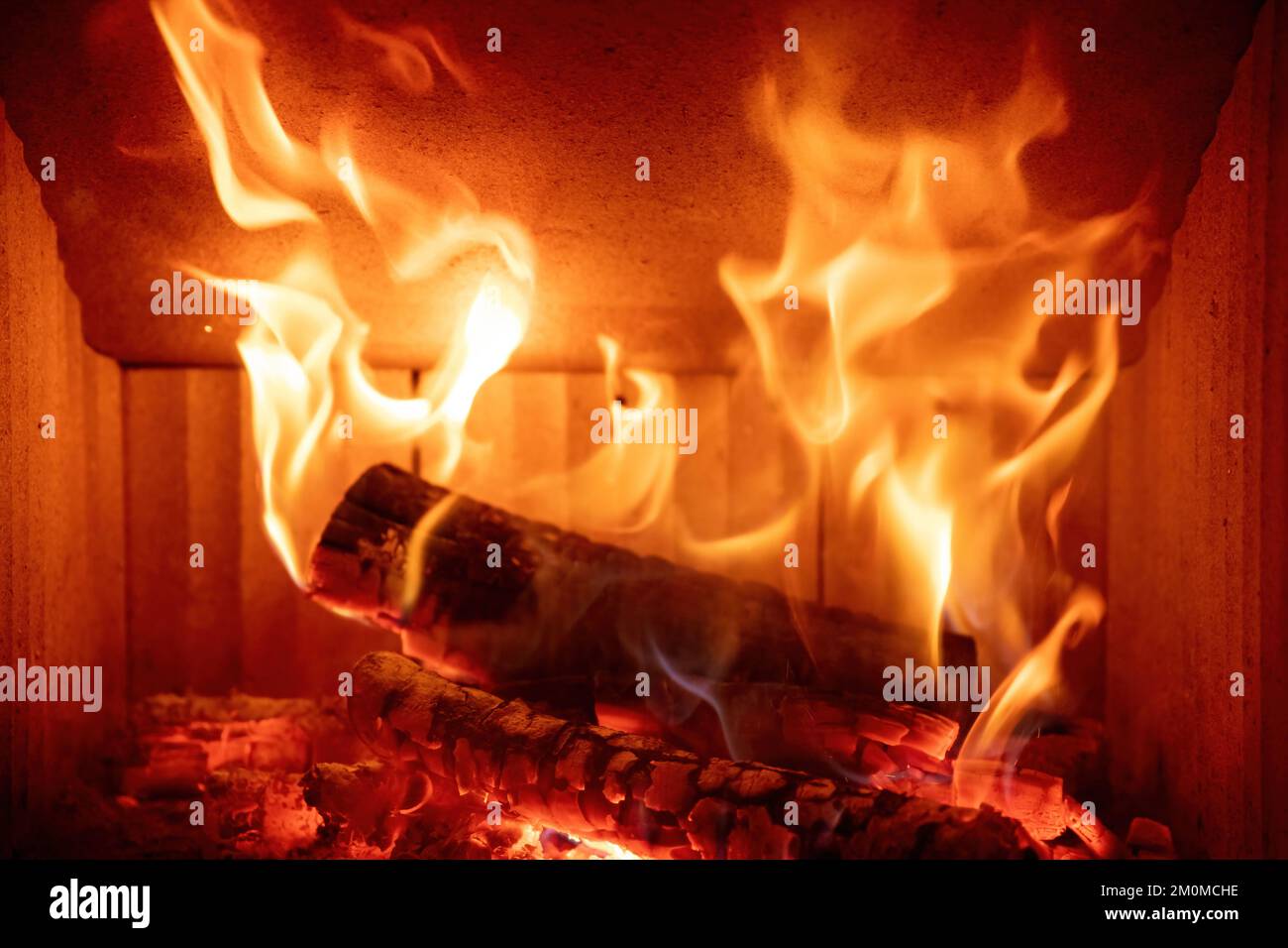 Fireplace close up, fire flame and burning wood logs, warm home in ...