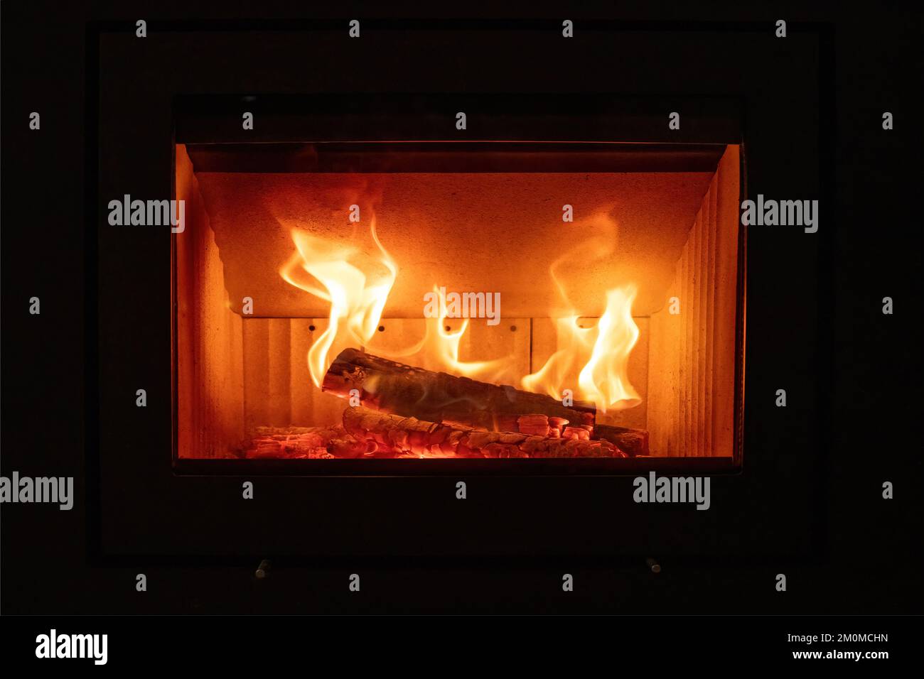 Fireplace close up, fire flame and burning wood logs, glass door ...