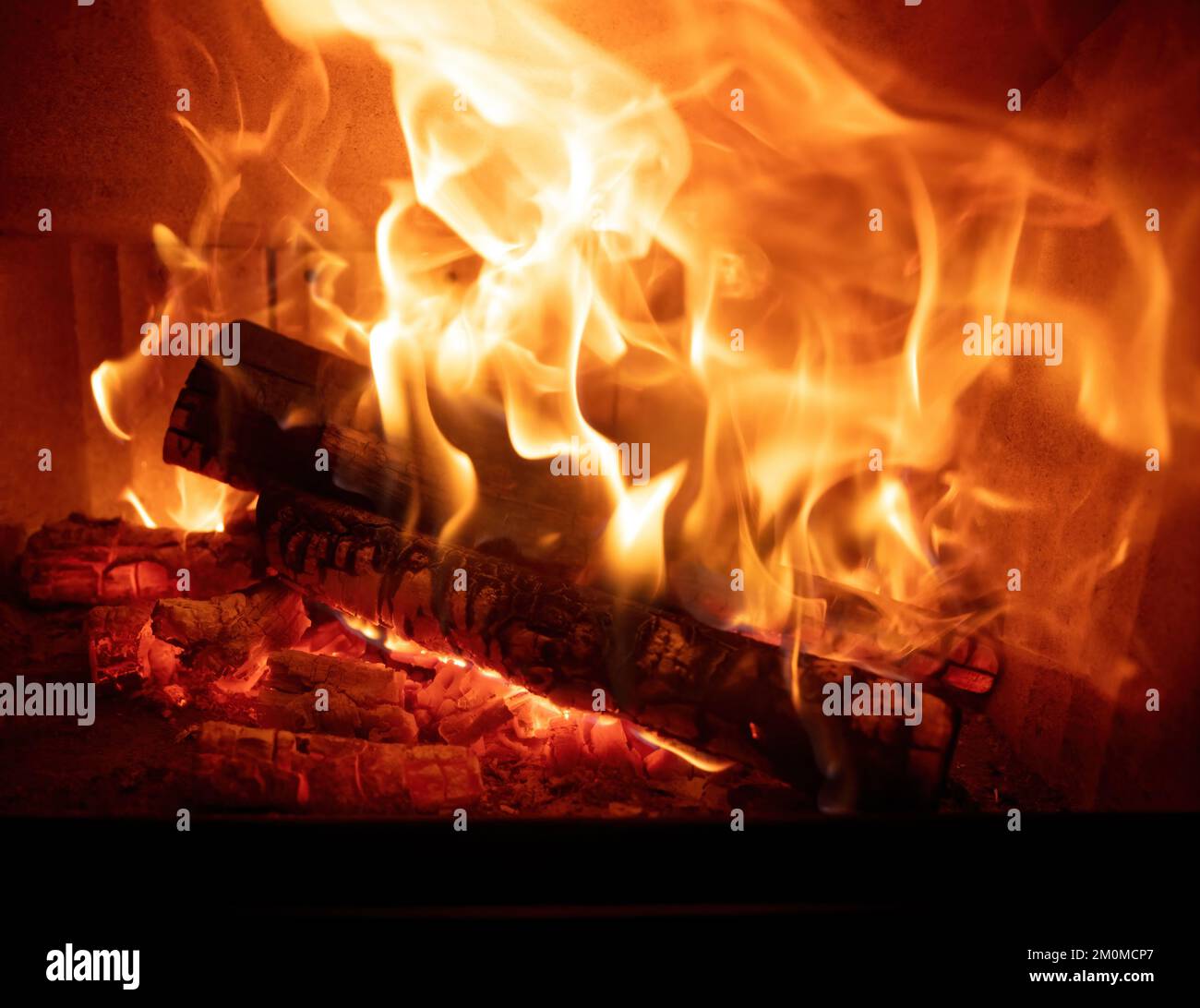 Fire flames and burning wood logs, fireplace close up, Warm home in ...