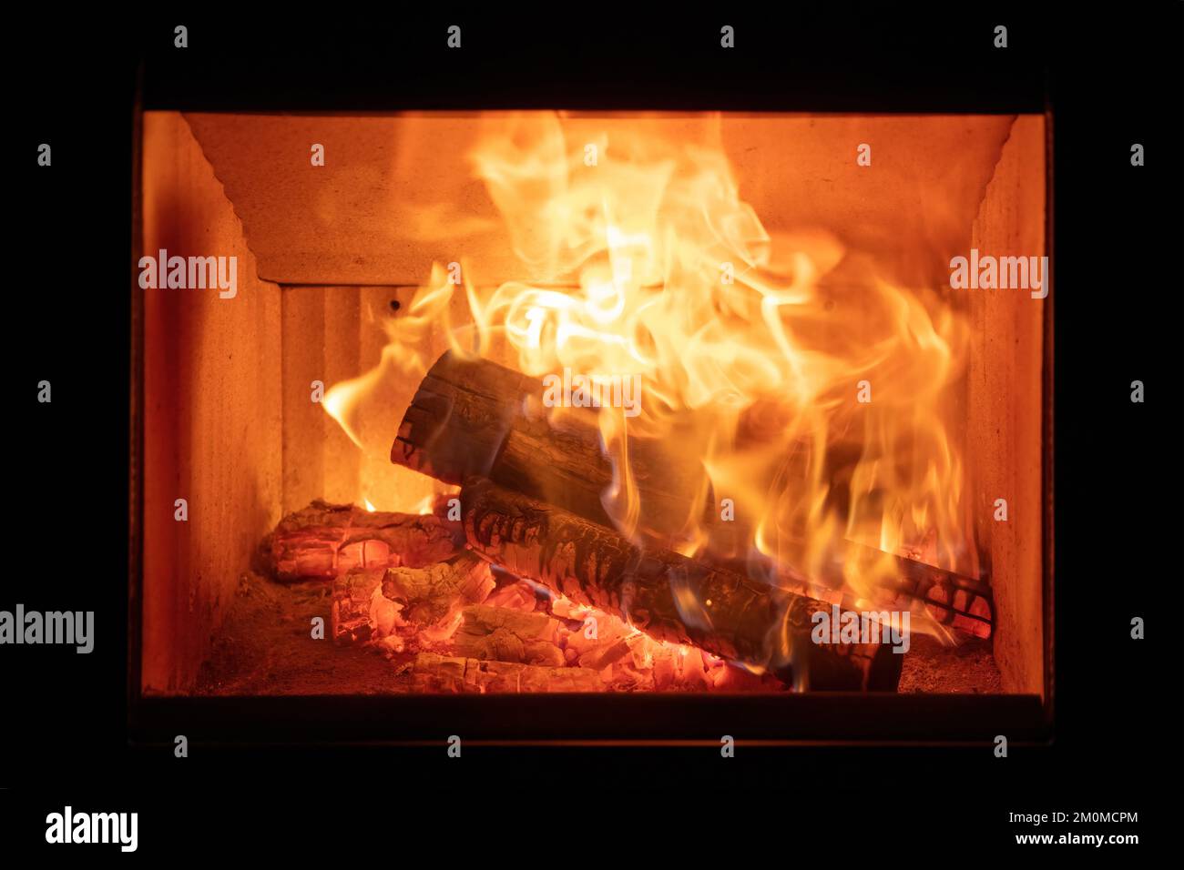 Fireplace close up, fire flame and burning wood logs, glass door ...