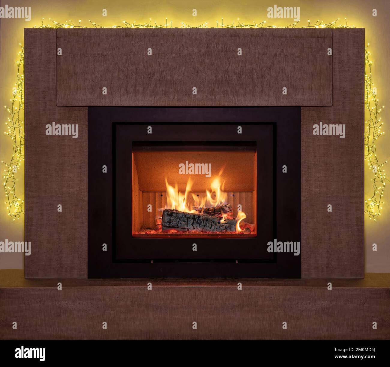 Bonfire, burning fireplace, Christmas lights decoration. Energy wood ...