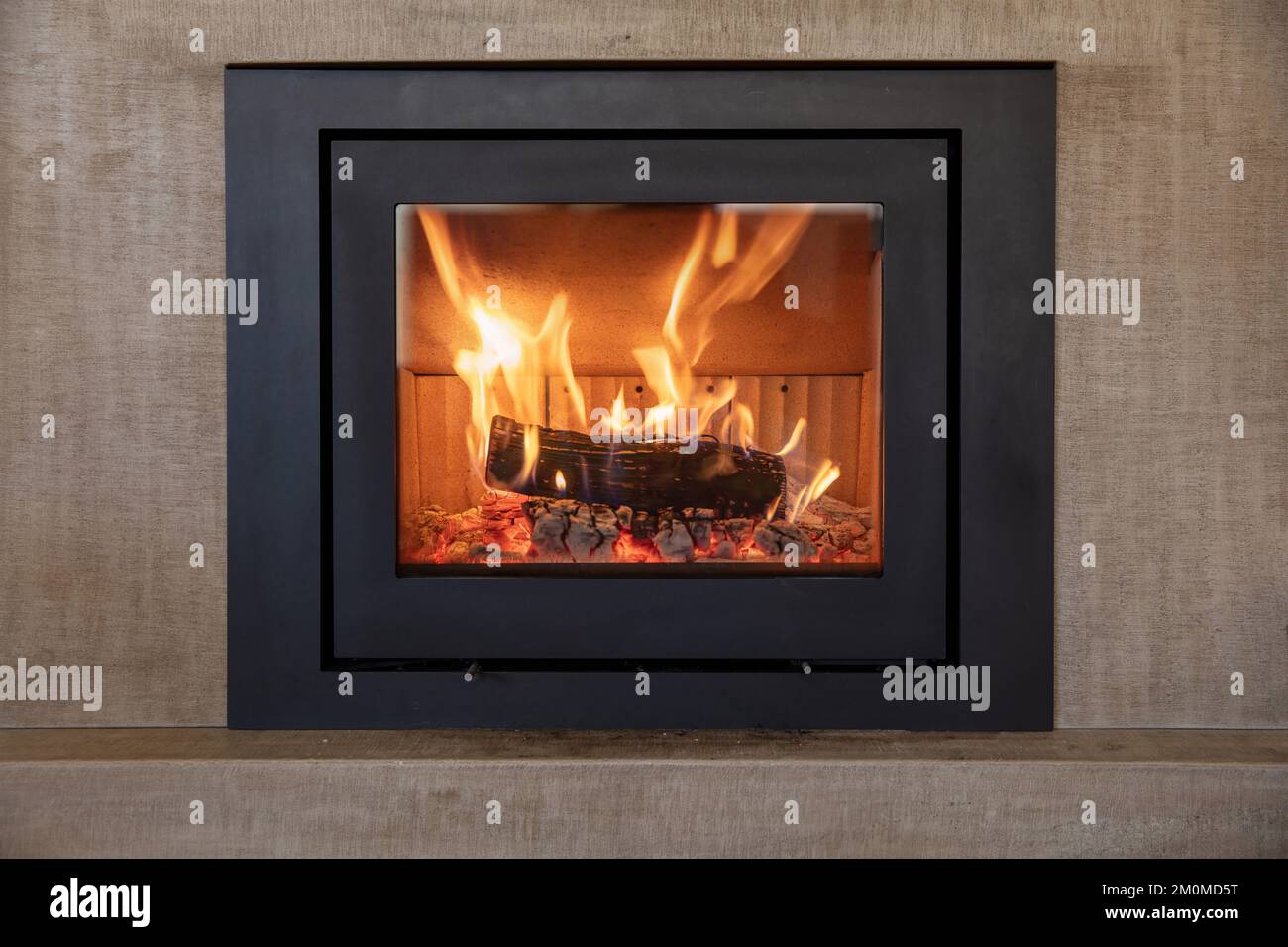 Burning fireplace, front view. Energy wood logs fireside, glass door ...