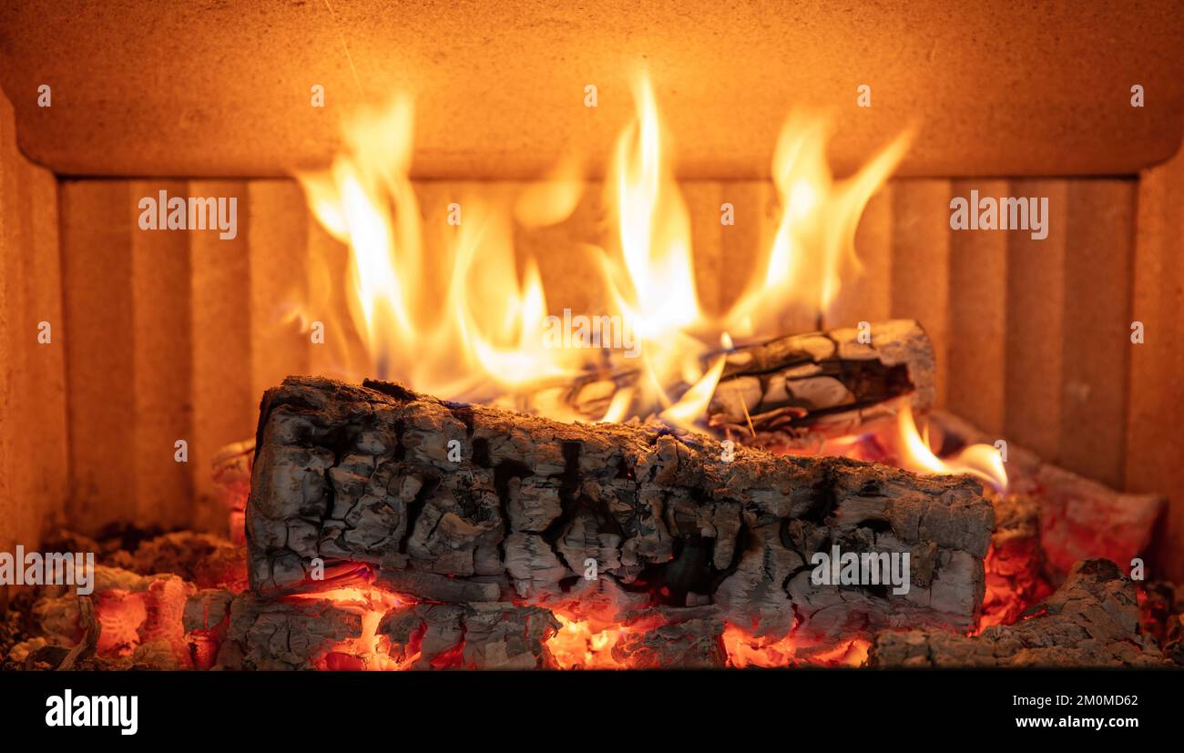 Fire burning in fireplace home hi-res stock photography and images - Alamy