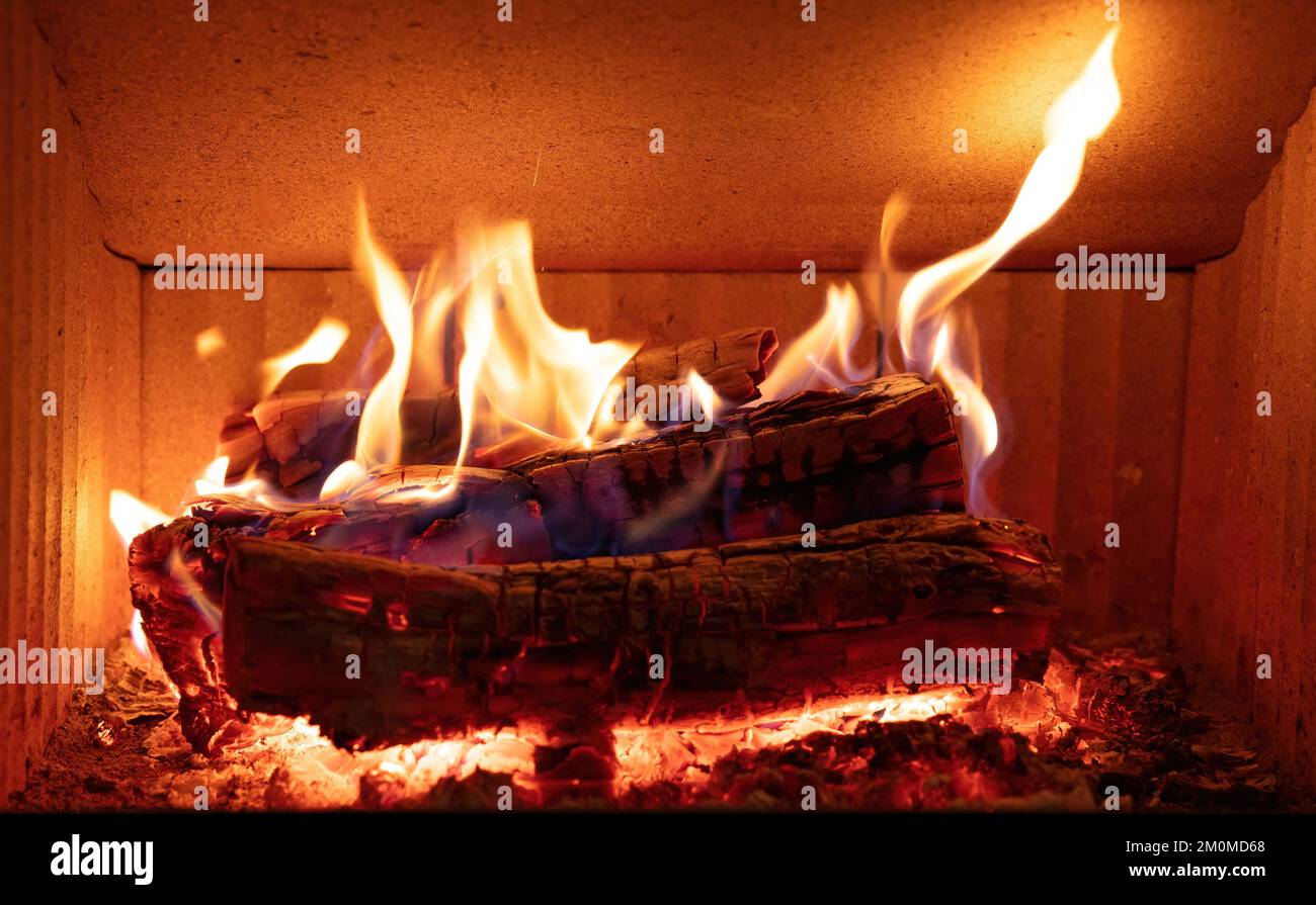 Fireplace close up, fire flame and burning wood logs, warm home in ...