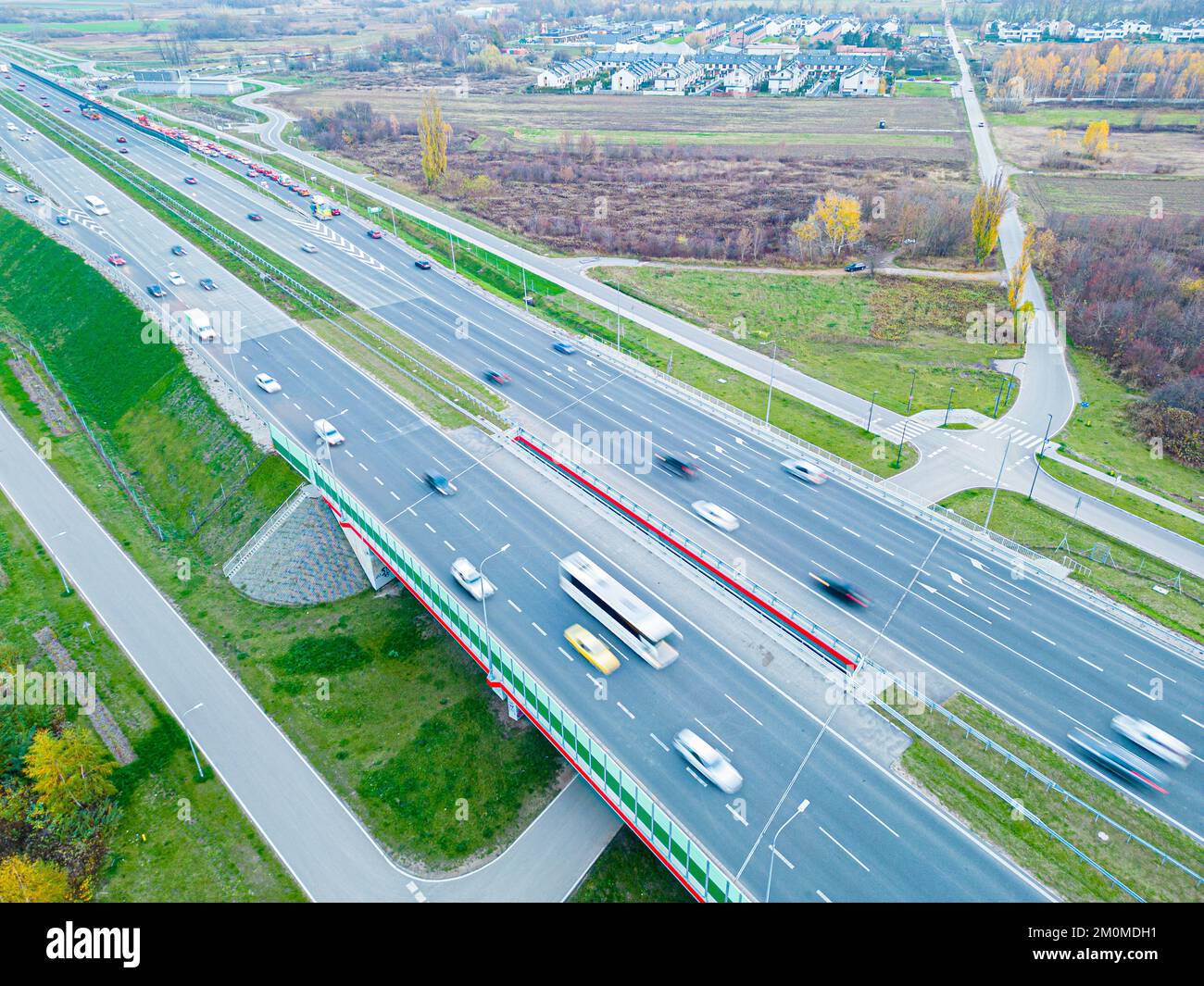 Aerial top view of bridge road automobile traffic of many cars ...