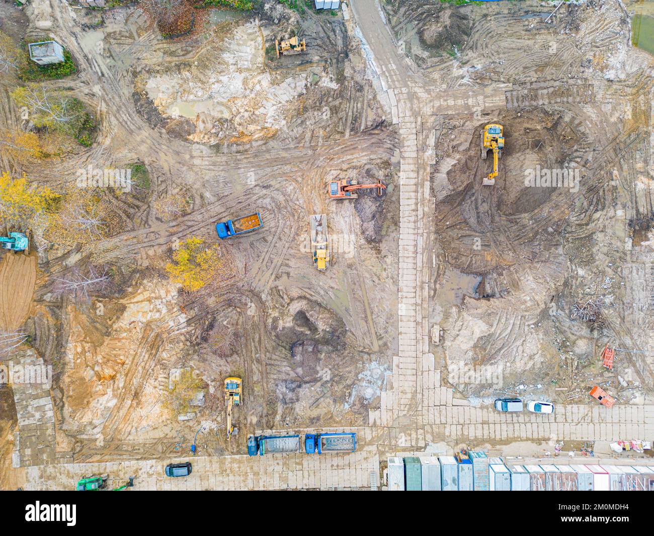 Aerial photo of an excavator and bulldozers working on a construction ...
