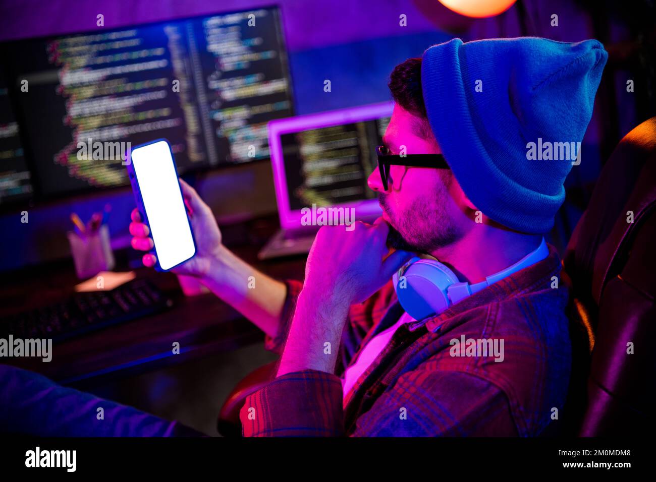 Photo of confident thoughtful guy dressed glasses hat typing twitter ...