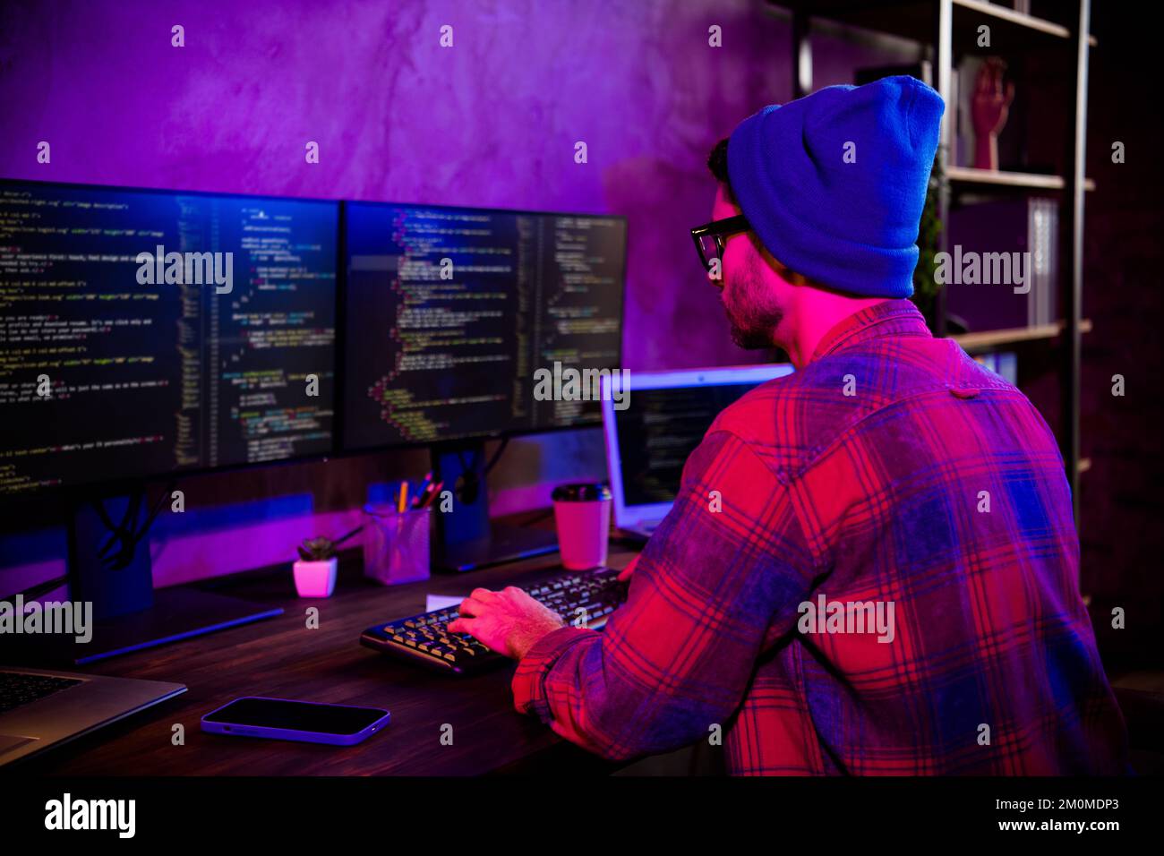 Photo of confident cool programmer wear hat spectacles typing framework ...