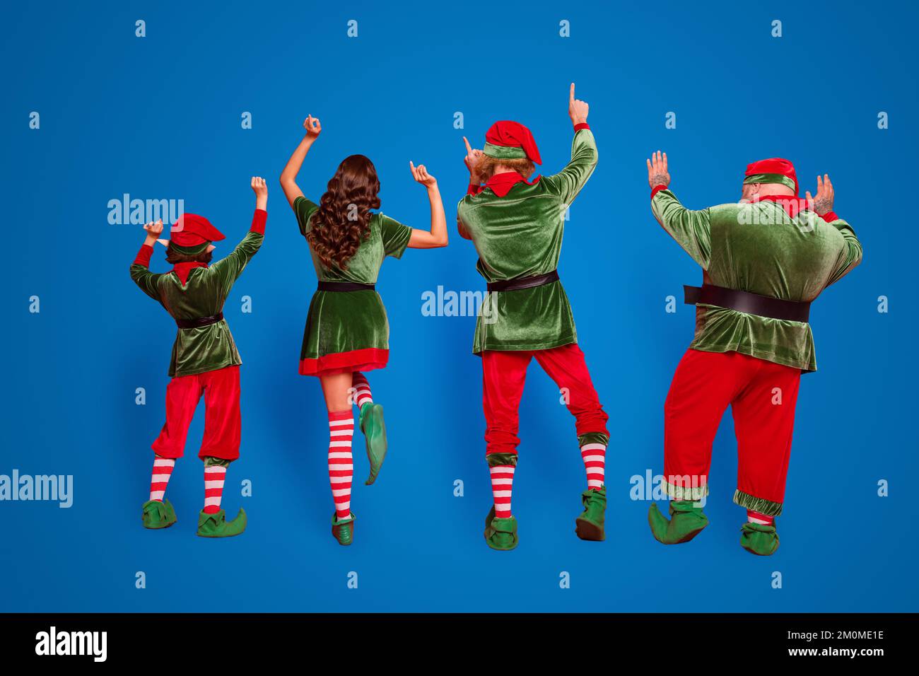 Back rear spine view full body photo of people elf dance christmas ...