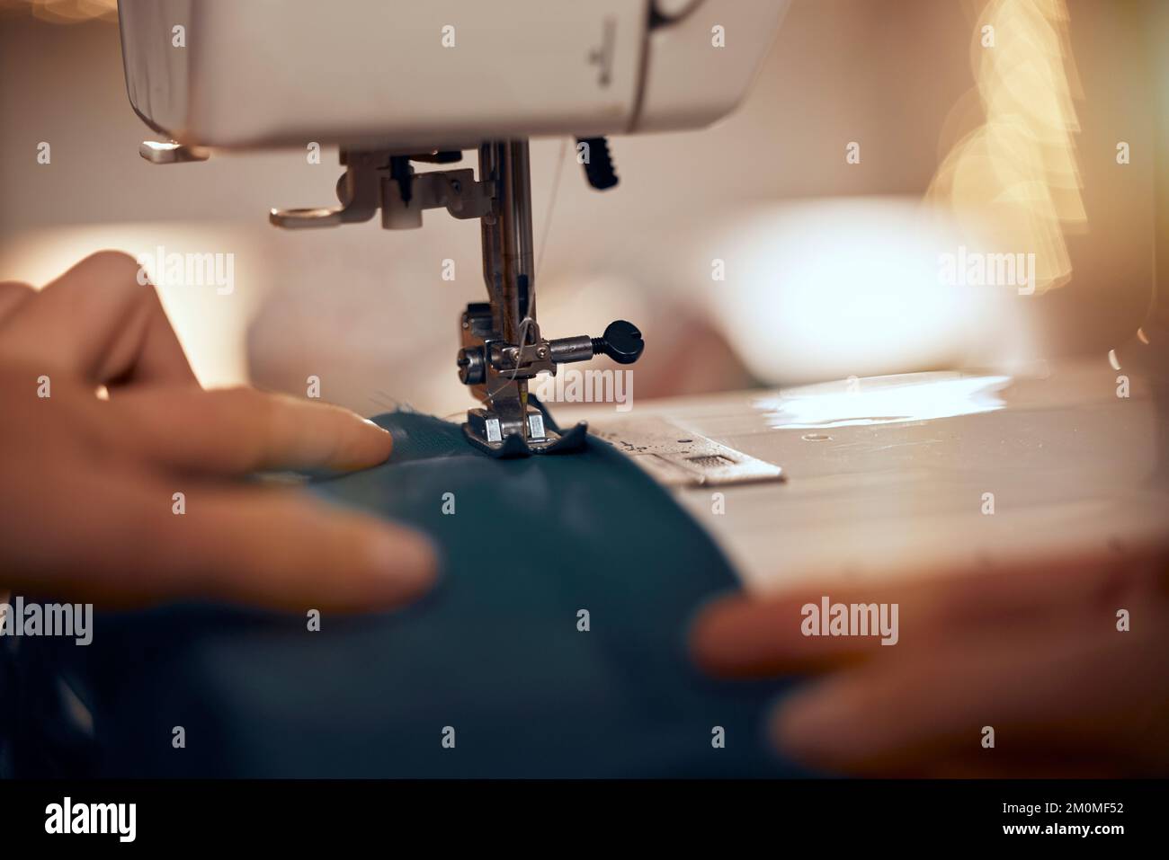 Design, clothes and closeup of sewing machine with fabric for clothing ...