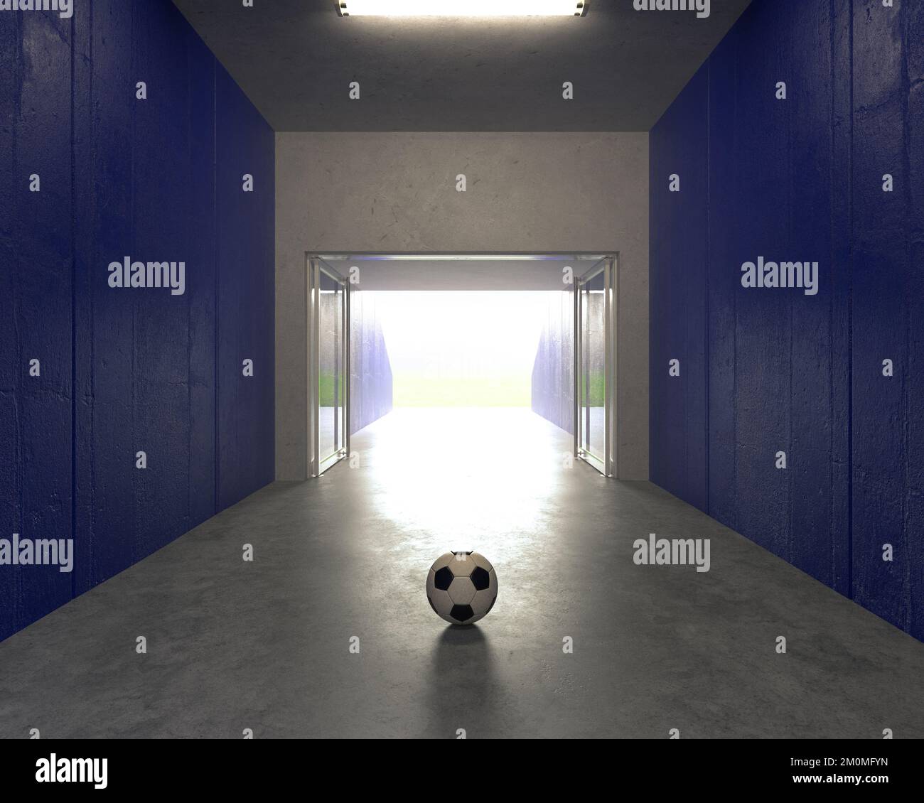 A soccer ball on the floor in a stadium sports corridor with open glass ...
