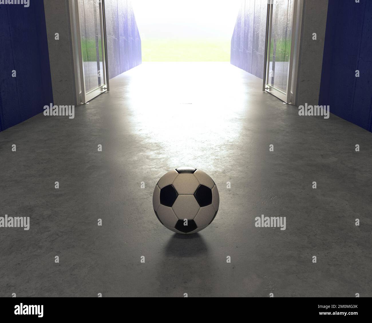 A soccer ball on the floor in a stadium sports corridor with open glass ...