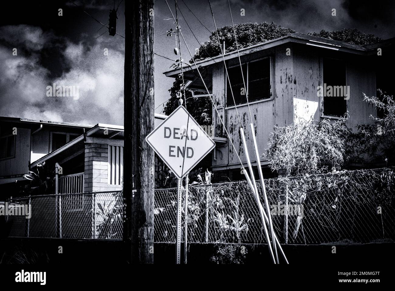 Scary black and white house on a dead end street Stock Photo - Alamy