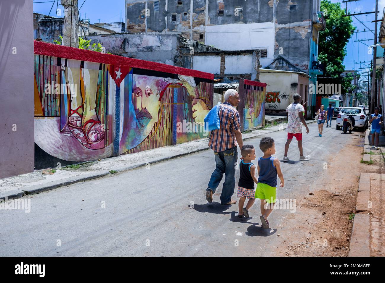 Cuban Latin people walking on Havana a family with an old guy and two ...