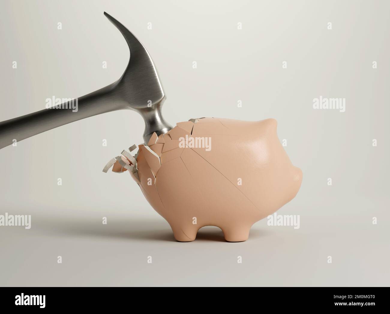 A ceramic beige piggy bank being smashed by a regular hammer on an ...