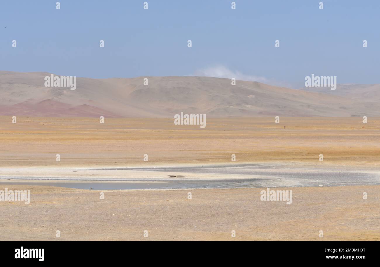 Extraordinary reddish desert landscape along the Pacific coast of Peru ...