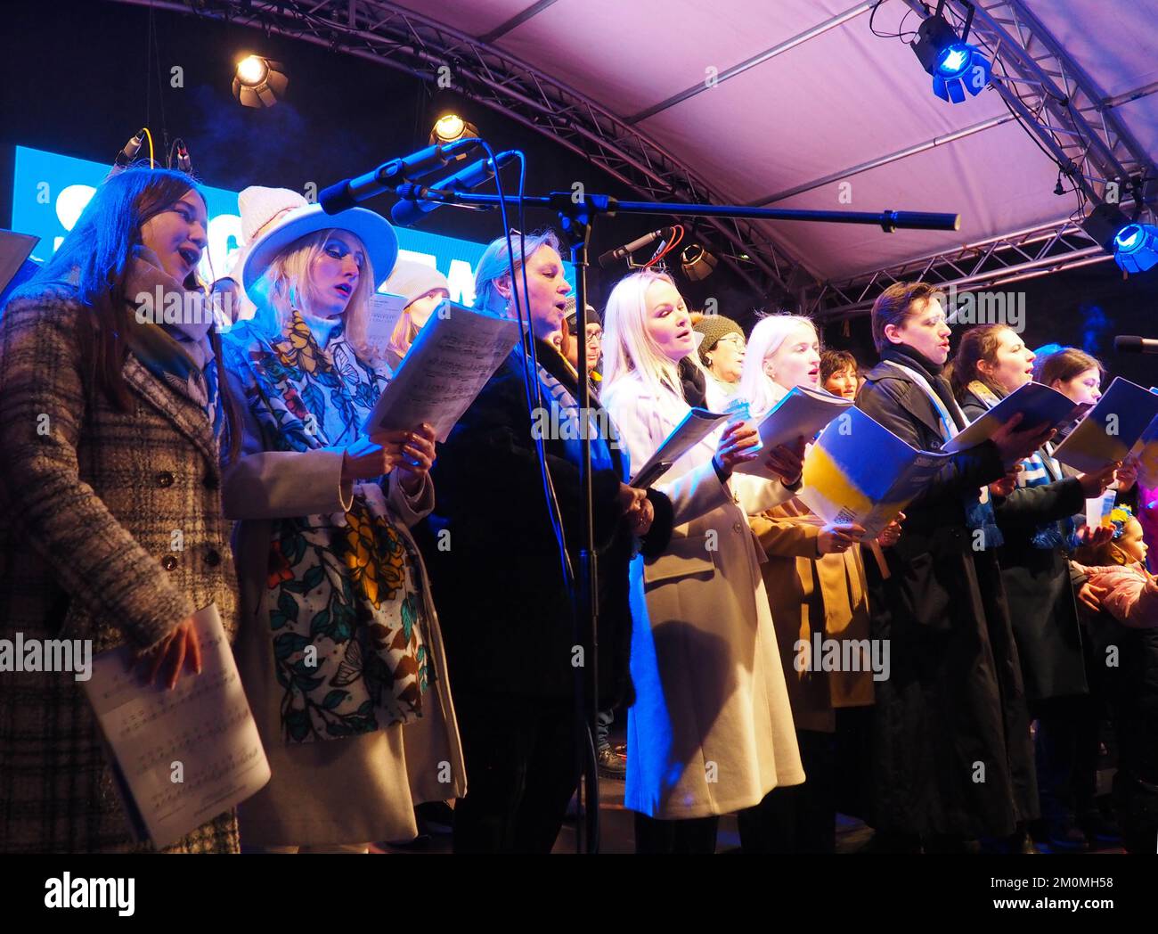 A group of people singing on the stage. Sing for Peace. Darmstadt ...