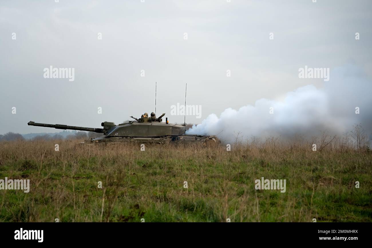 side profile close-up of commander and gunner directing action on a ...
